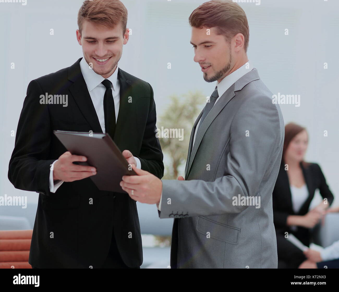 Image of business partners discussing documents and ideas at mee Stock ...