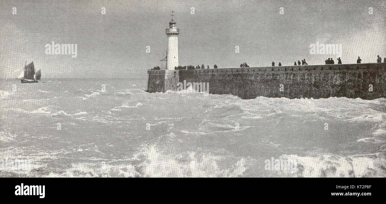 The lighthouse located at the tip of a jetty in the English Channel ...
