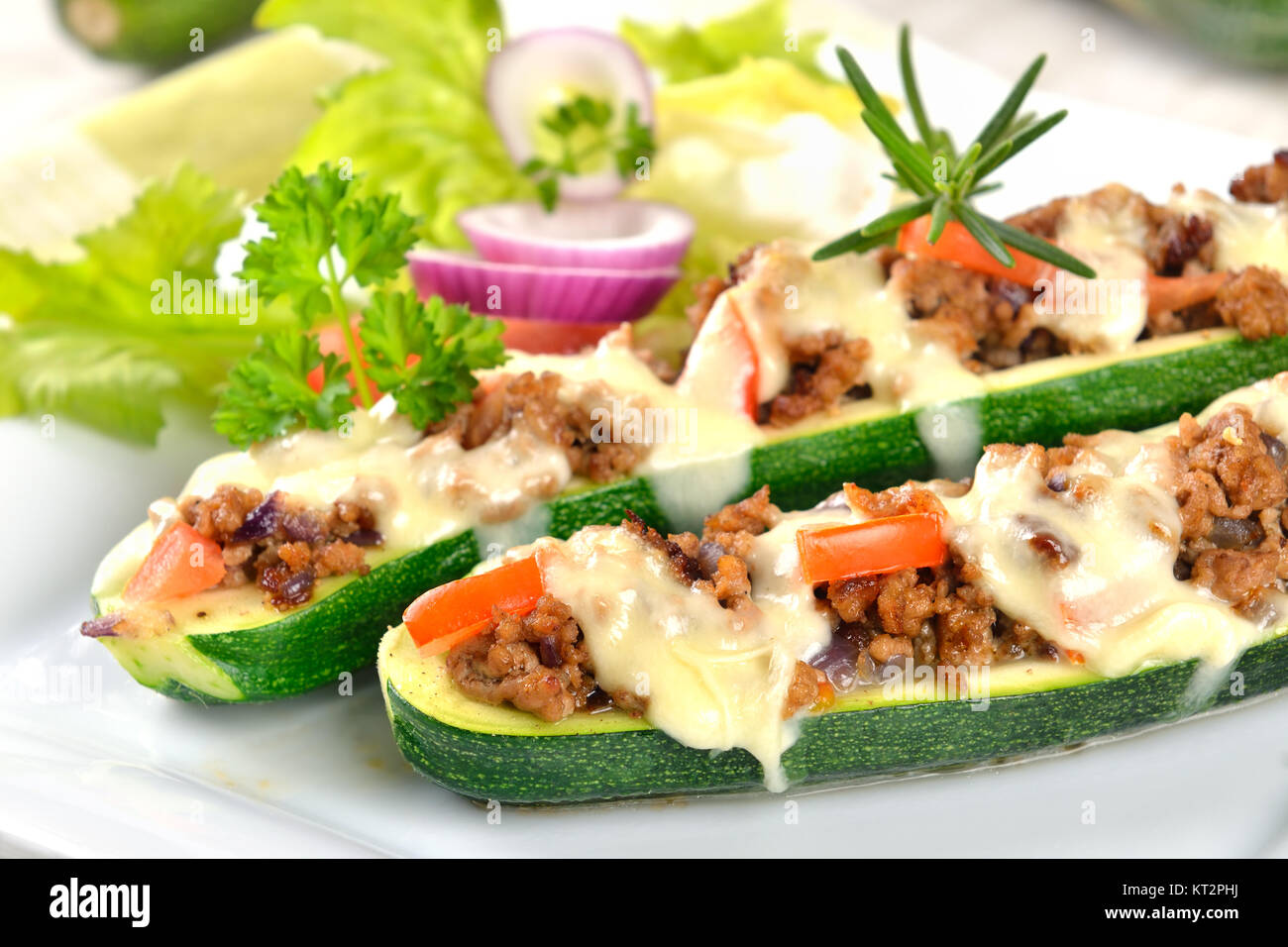 Zucchini halves stuffed with minced meat and gratinated with mozzarella ...