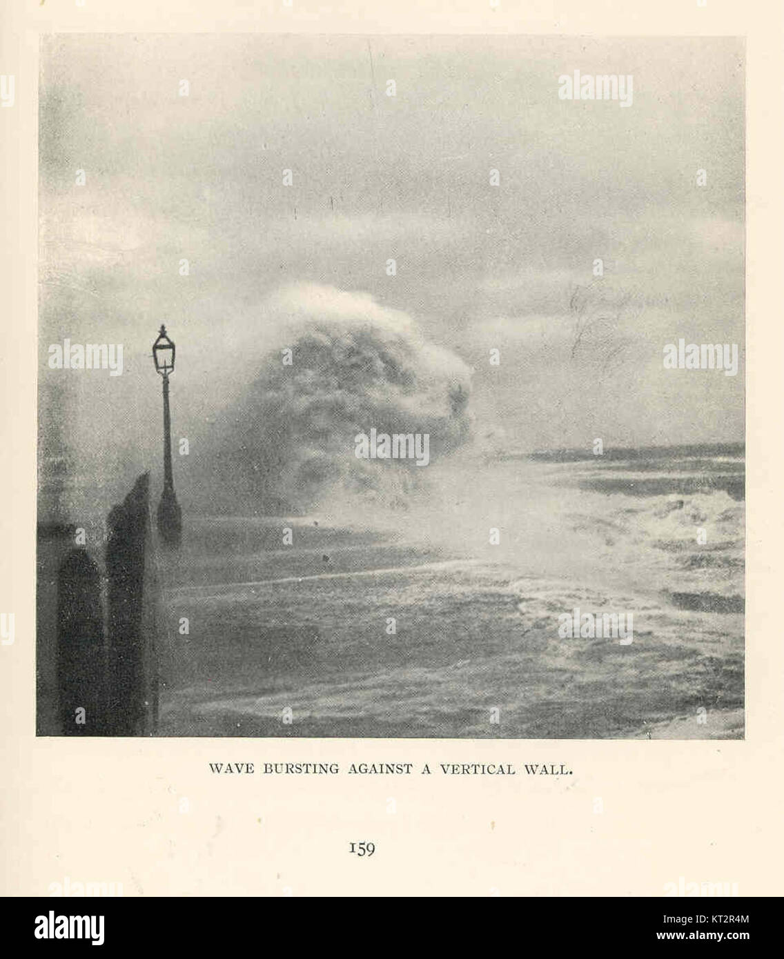 This image captures the force of a wave bursting against a vertical ...