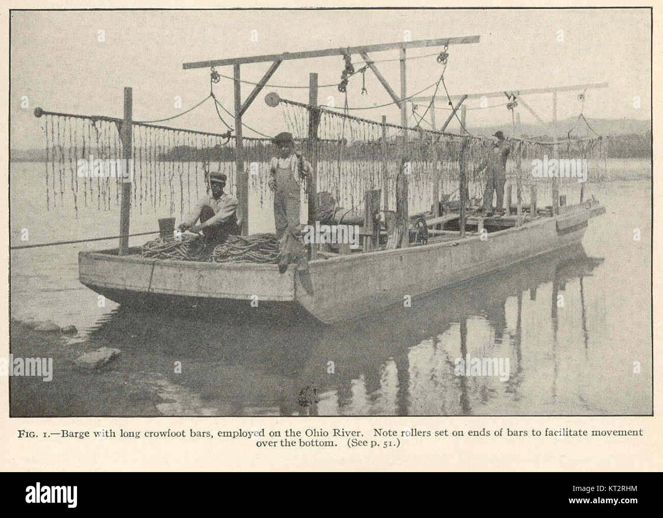 The image shows a barge with long crowfood bars used on the Ohio River ...