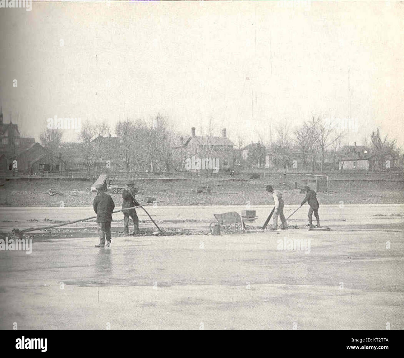 This historical image depicts mussel fishing through the ice on the ...
