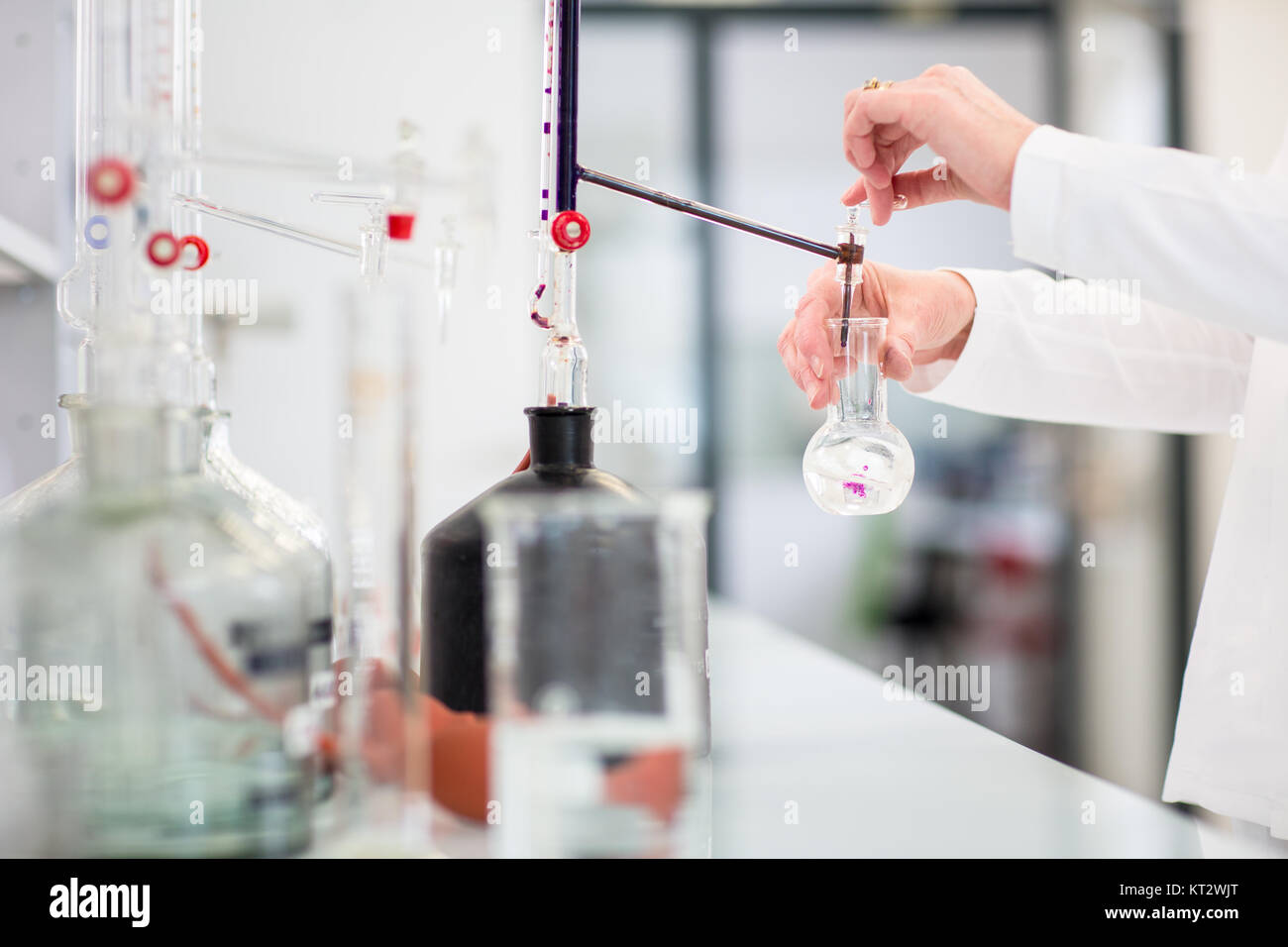 Lab worker's hands while at work at a research center in a lab ...