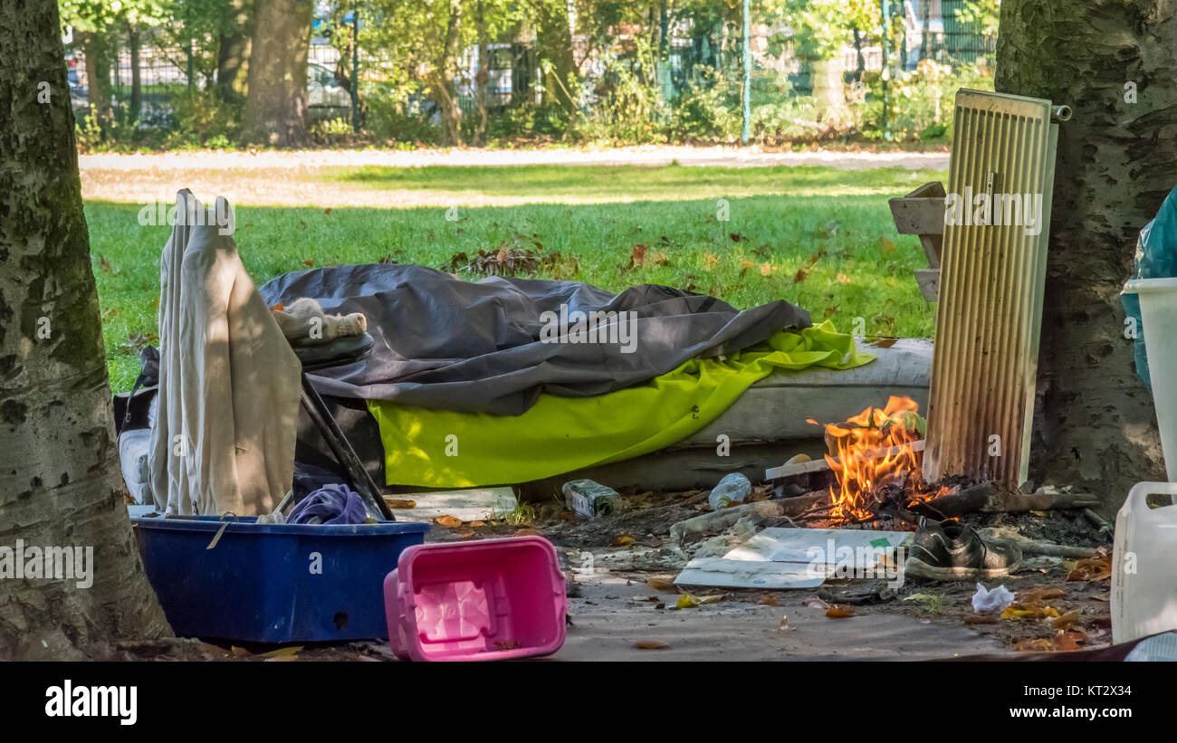 homeless camp in the park with a bonfire Stock Photo - Alamy