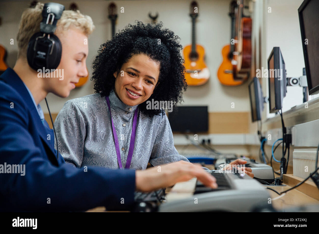 Learning Keyboard In Music Class Stock Photo - Alamy