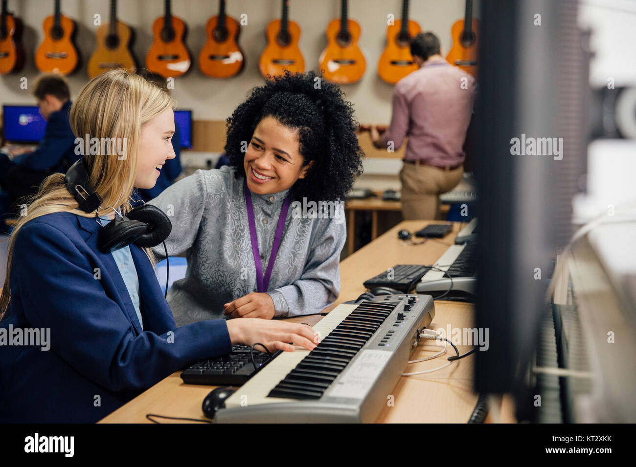 Learning Keyboard In Music Lesson Stock Photo - Alamy