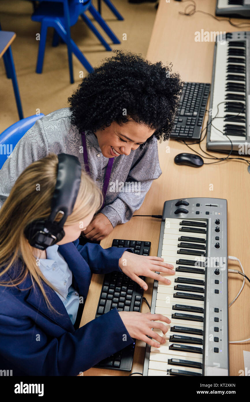 Learning Keyboard In Music Lesson Stock Photo - Alamy