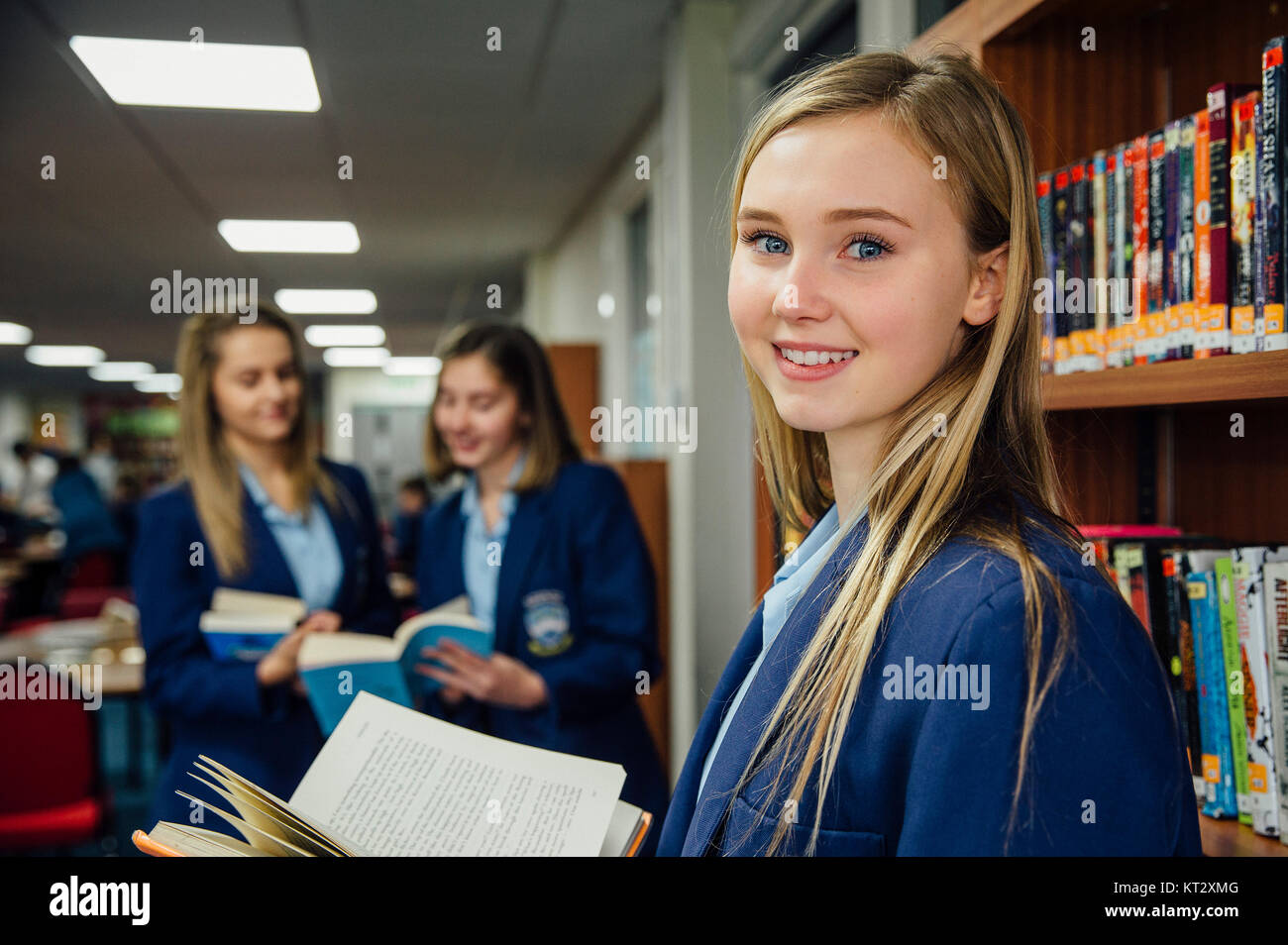 Reading In School Library Stock Photo - Alamy