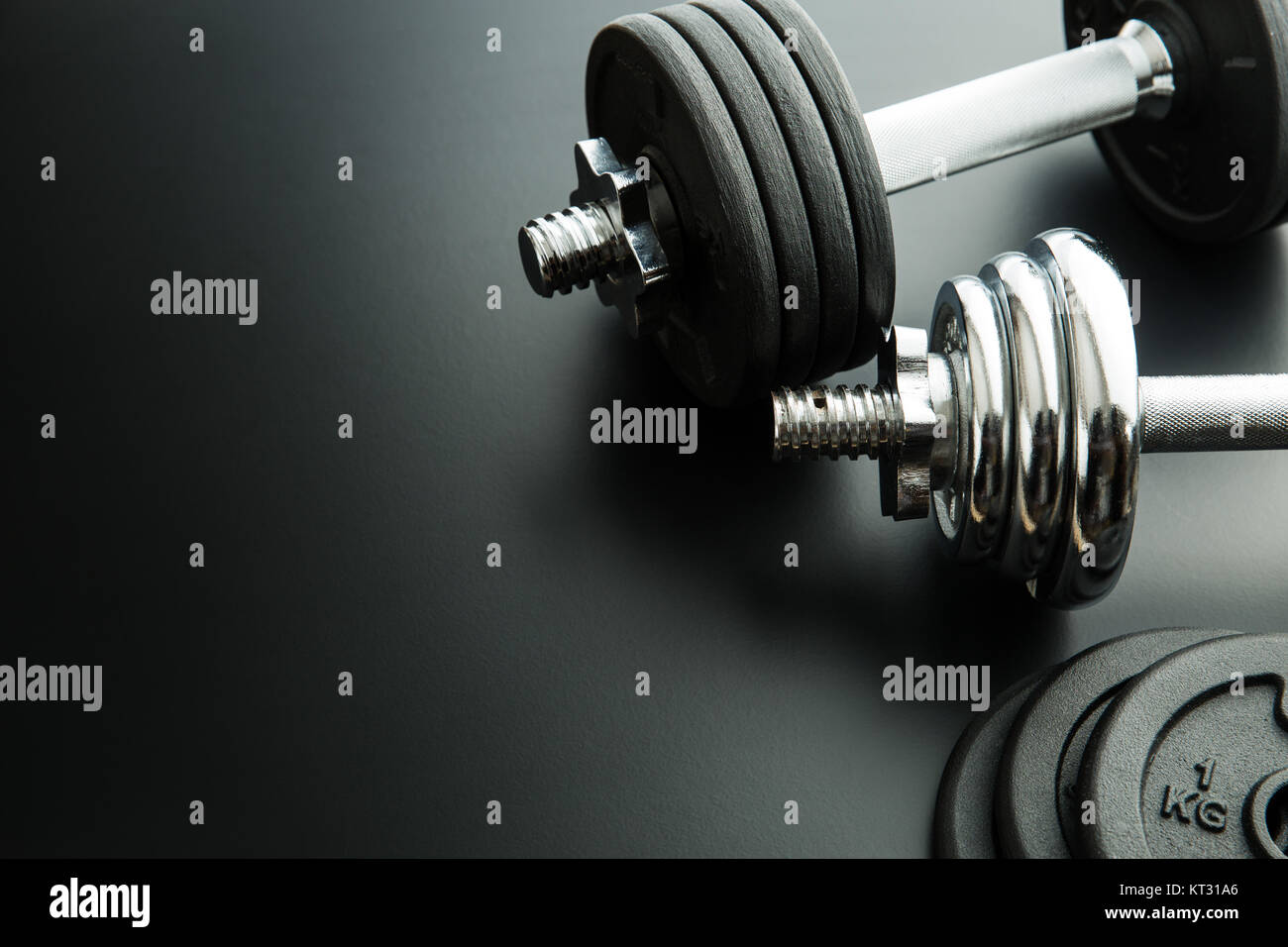 The metal dumbbell and weights Stock Photo - Alamy