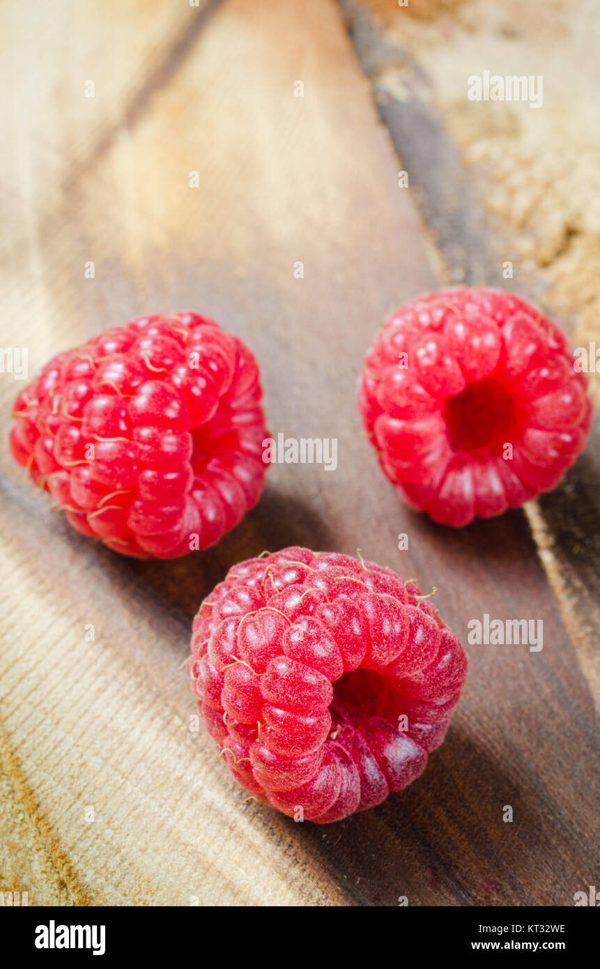 Fresh Organic Raspberry on Rustic Background Stock Photo - Alamy
