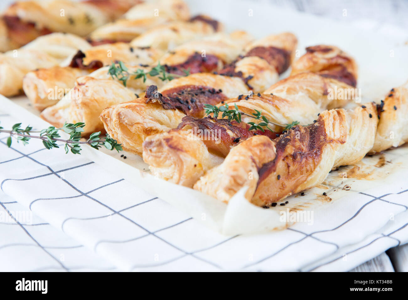 Bacon sticks pastry with black sesame and thyme Stock Photo - Alamy