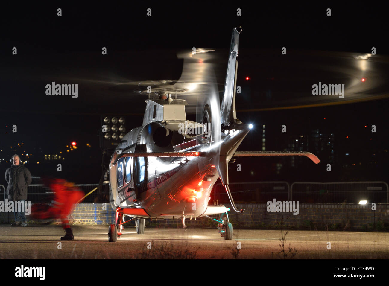 Helicopter being used as a prop on a film set during a night time film ...