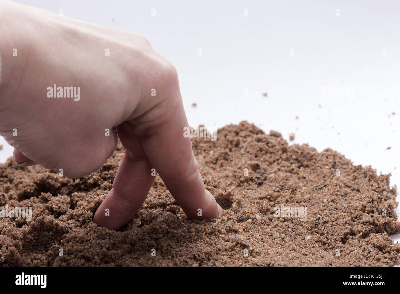hand walking with fingers through sand Stock Photo - Alamy