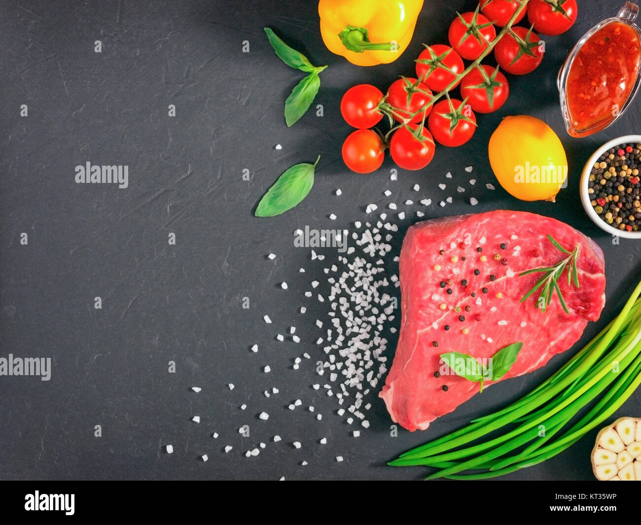 raw meat on dark background Stock Photo - Alamy