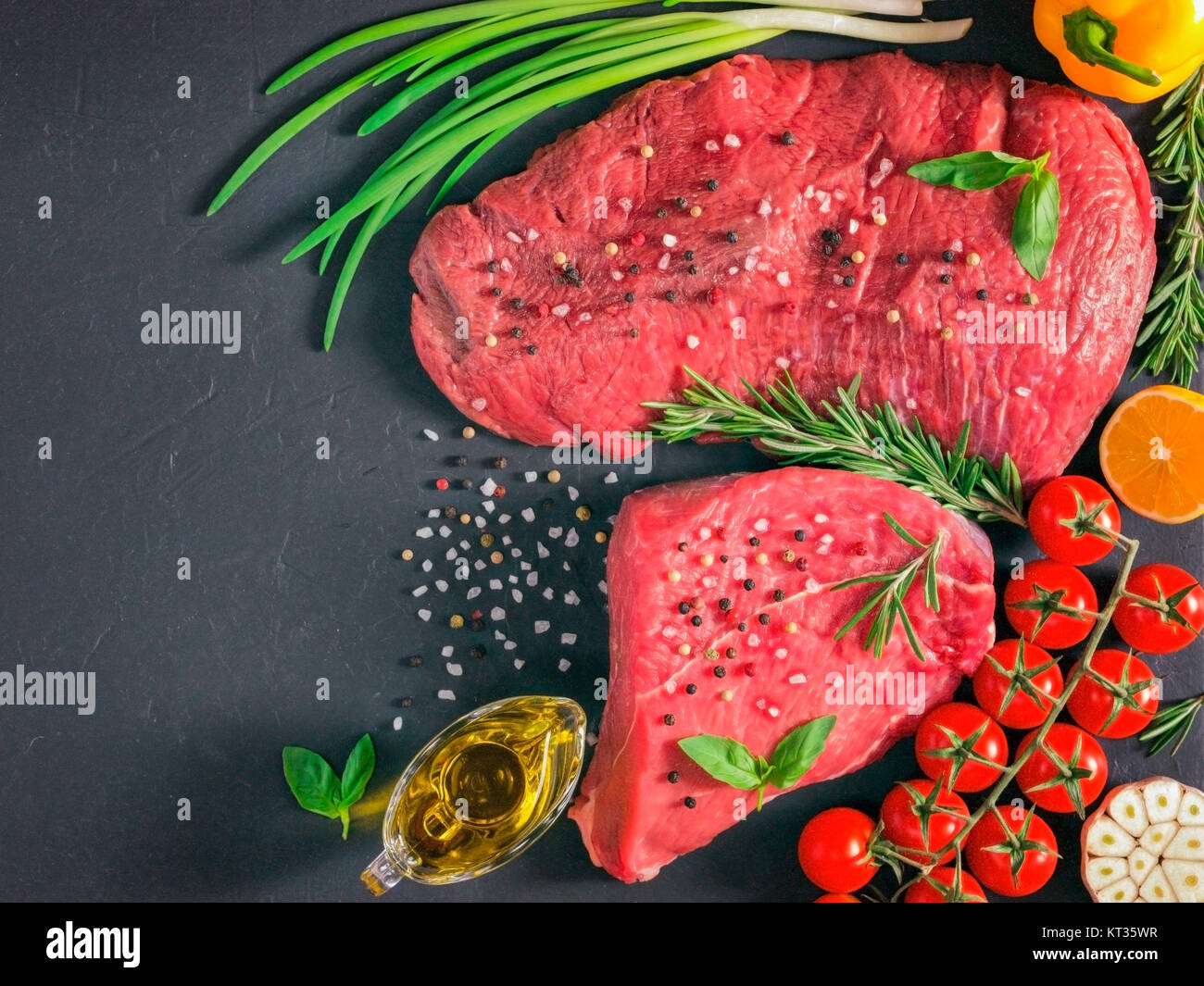 raw meat on dark background Stock Photo - Alamy