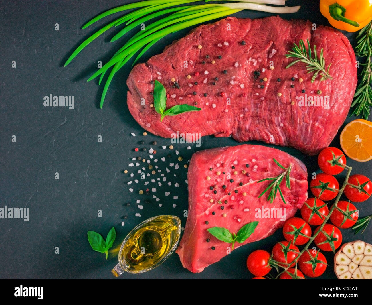 raw meat on dark background Stock Photo - Alamy