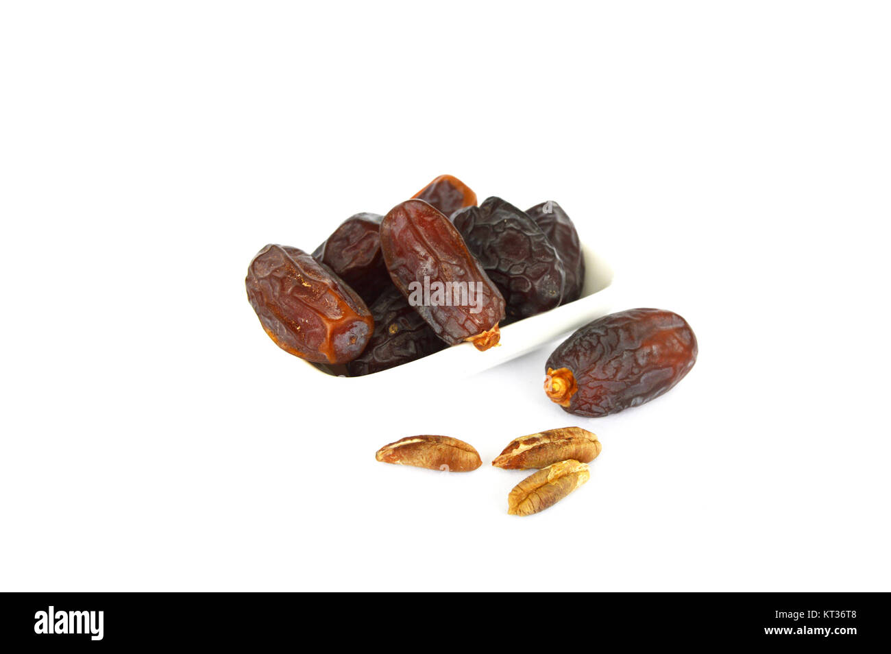 White background in plate with fruit and date- fruit seed pictures ...