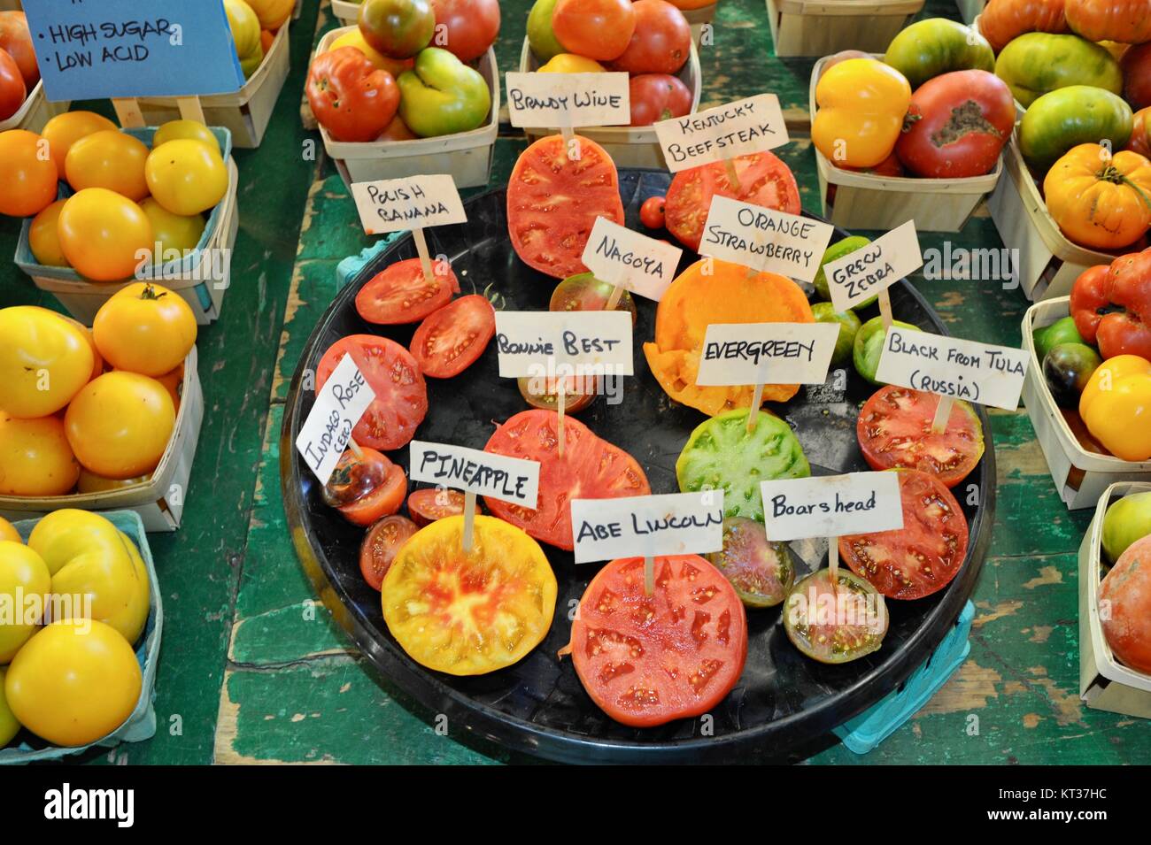 Sliced arrangement of colorful heirloom tomato types on display at ...