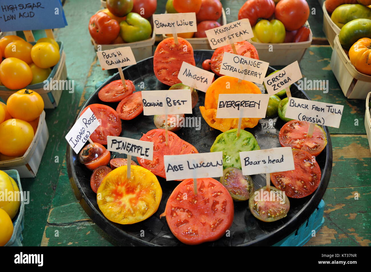 Sliced arrangement of colorful heirloom tomato types on display at ...