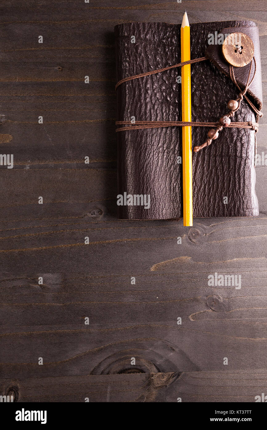 Top view on vintage retro notebook with leather cover and a pencil on ...