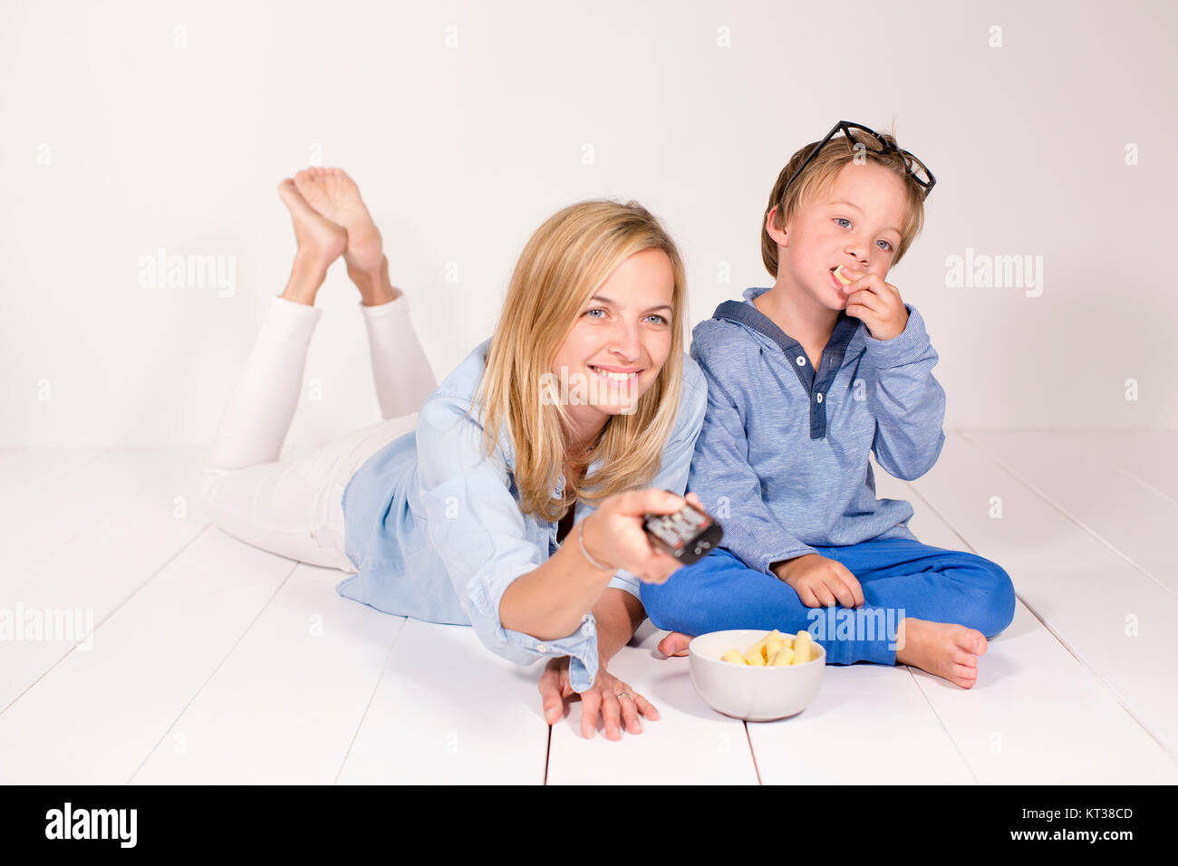 mother and child watch tv Stock Photo - Alamy