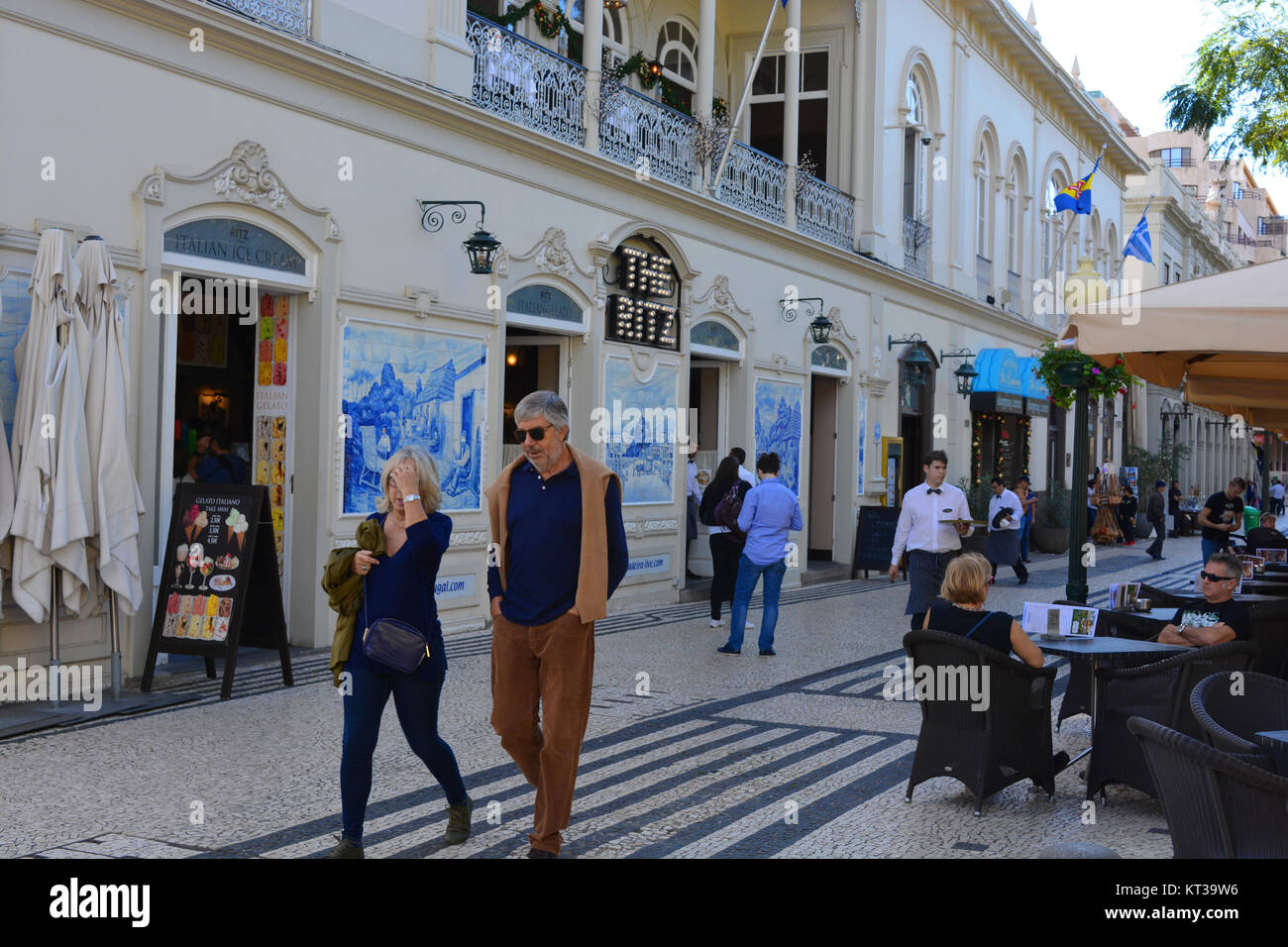 Couple walking past The Ritz Madeira, Avenida Arriaga, Funchal, Madeira ...