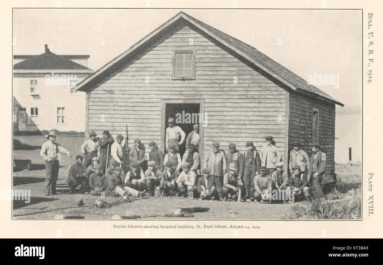 This photograph captures Native laborers moving a hospital building on ...