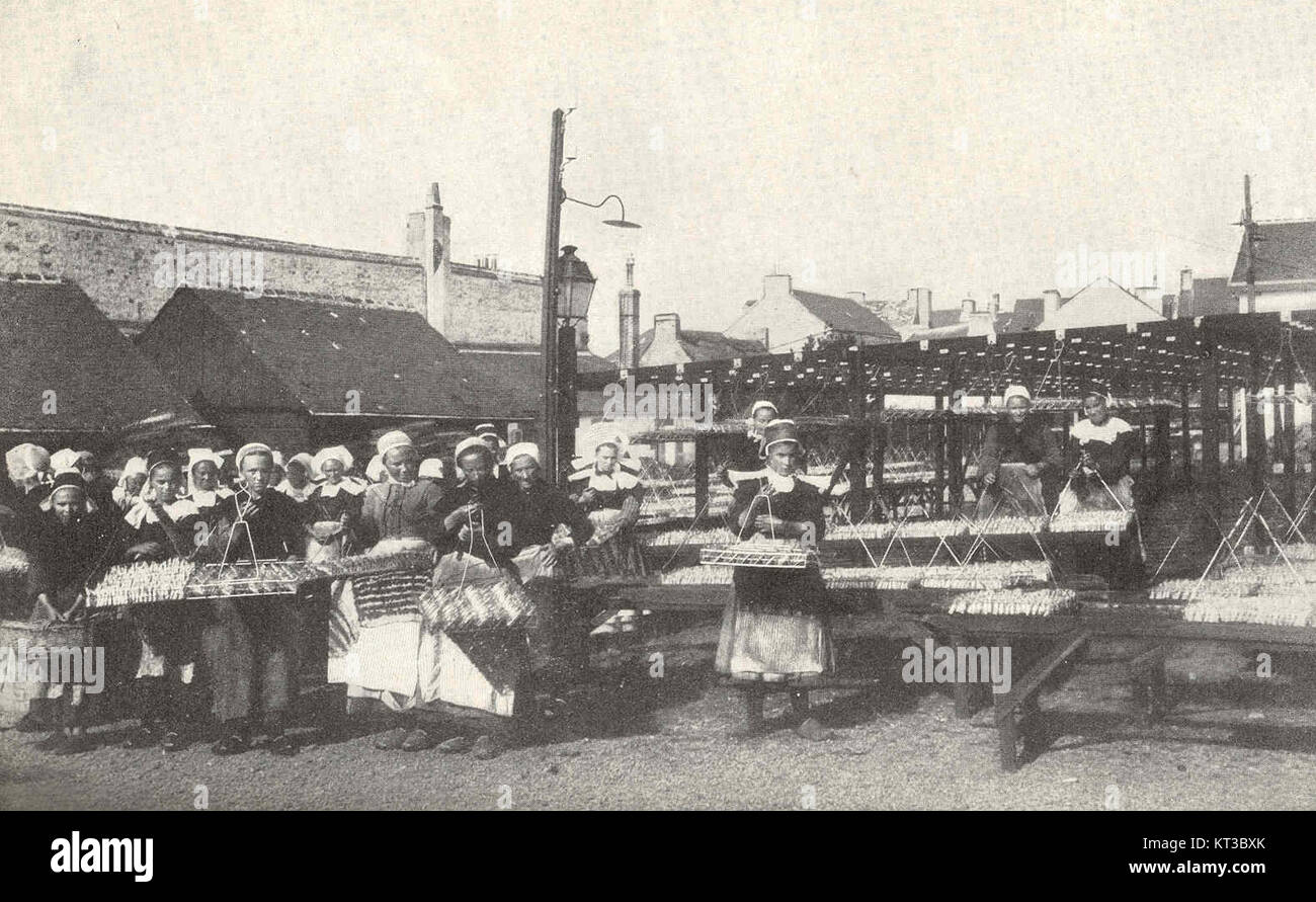 This image shows women working in a drying yard at a cannery, preparing ...