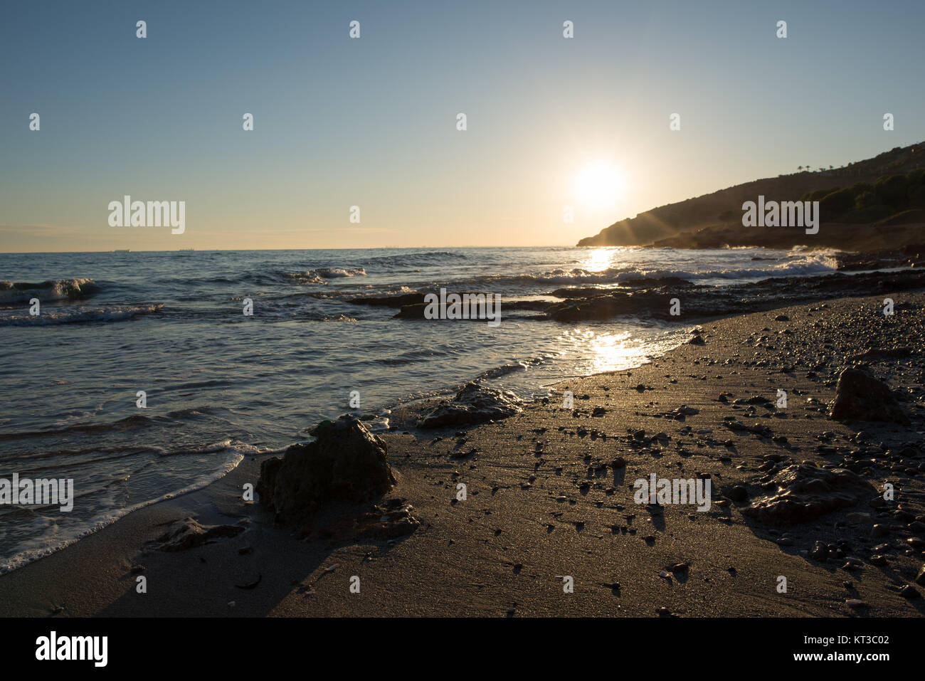 The calm sea in a very cloudy sunset in Spain Stock Photo - Alamy