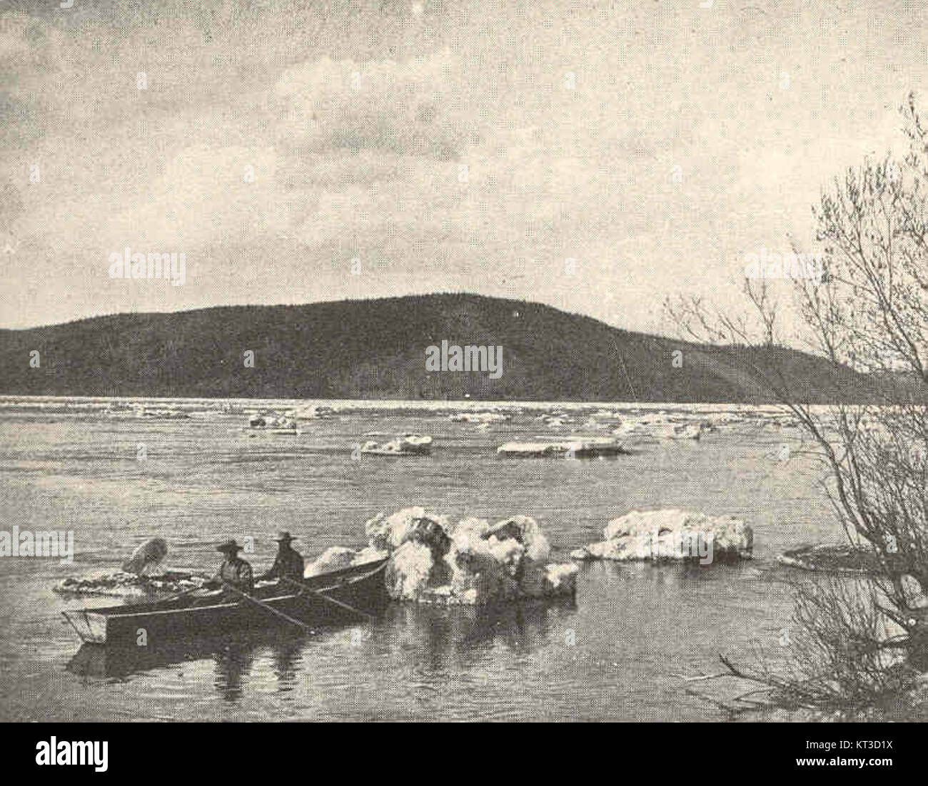 This historical photograph shows miners embarking on a prospecting trip ...