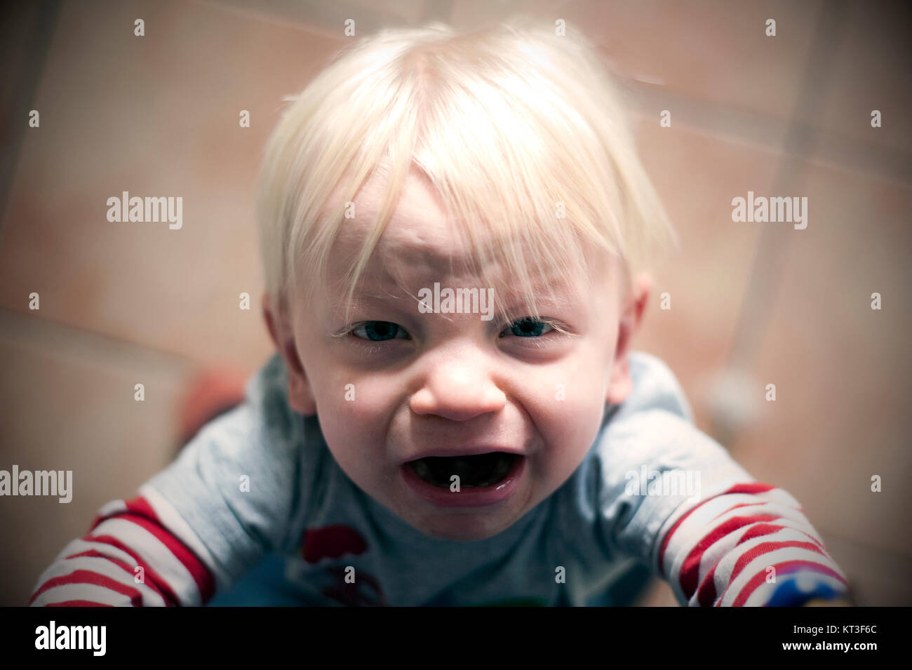 Child pick up toy hi-res stock photography and images - Alamy