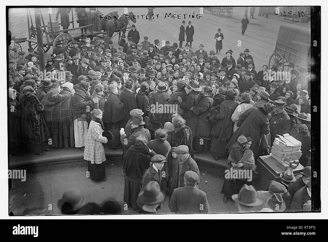 A photograph of a food protest meeting, capturing a gathering of ...