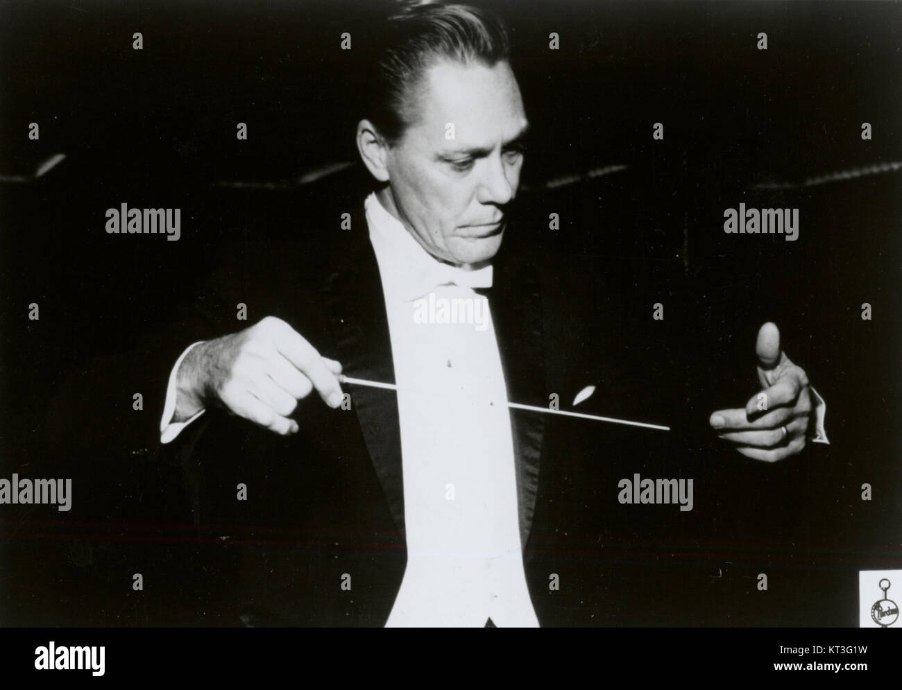 Alfred G. Wright, a renowned conductor, is shown leading an orchestra ...