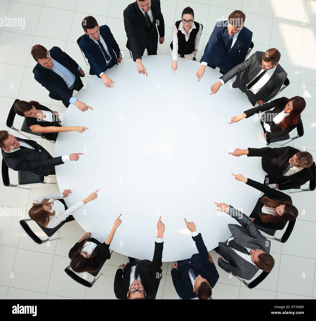 closeup .business team pointing in the center of the table Stock Photo ...