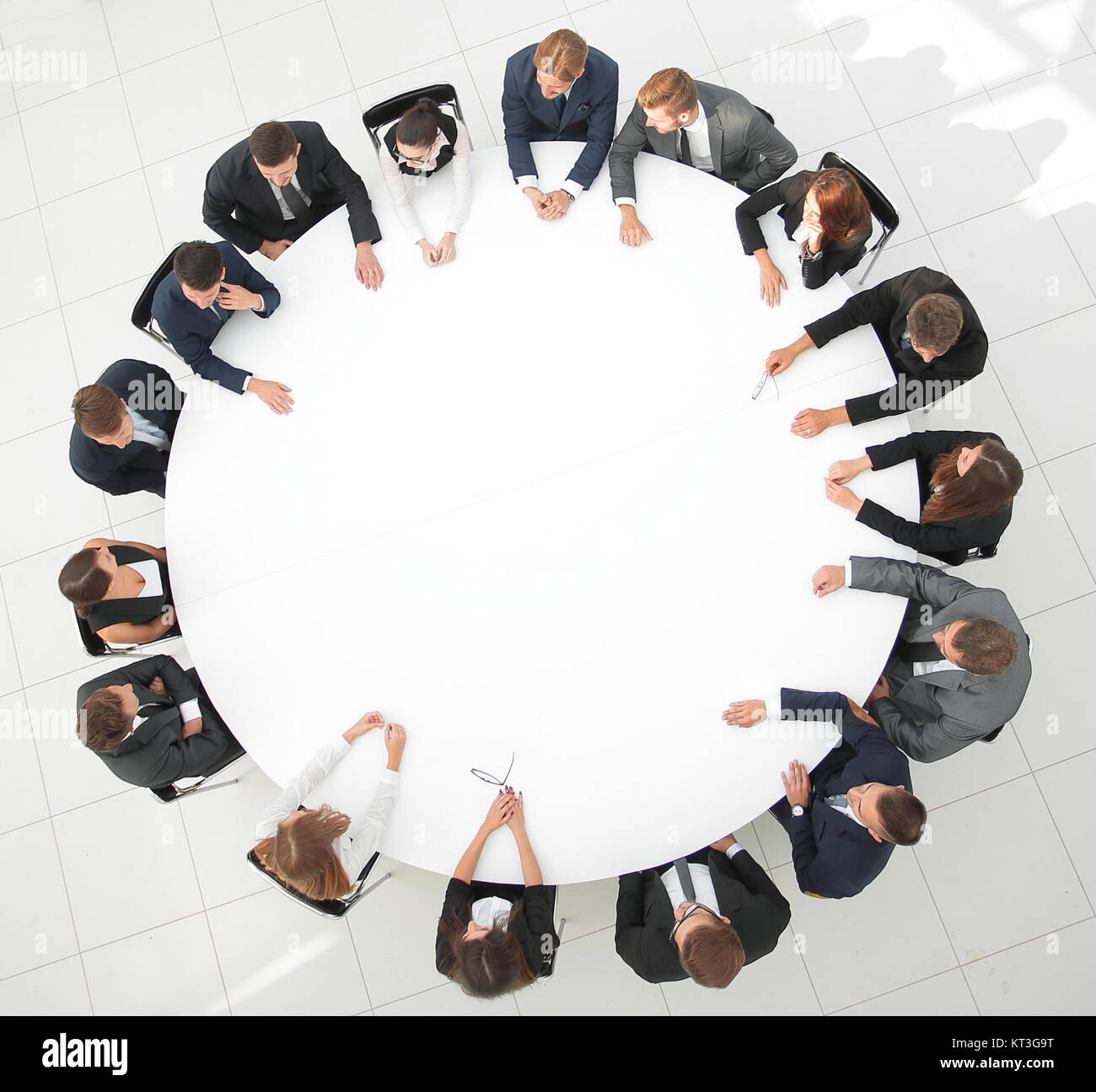 large group of business people sitting at the round table. the business ...
