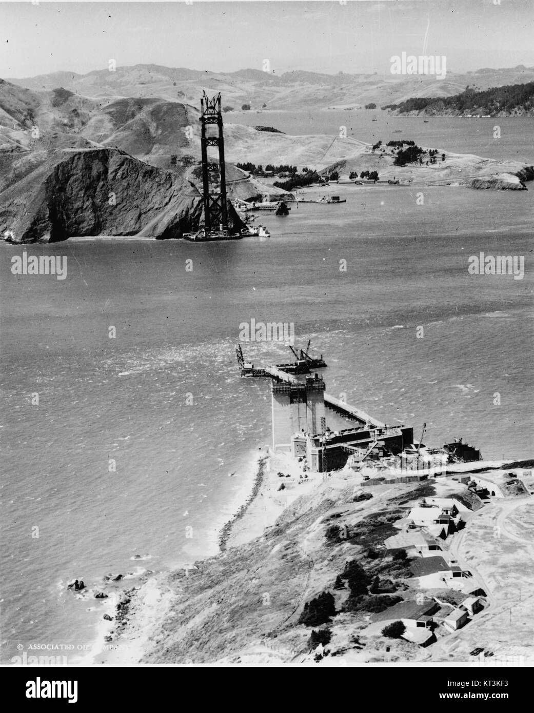 The image shows the Golden Gate Bridge under construction, highlighting ...