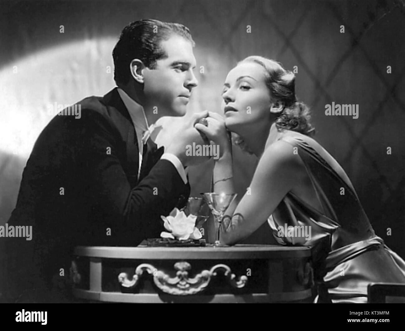 Hands across the table Stock Photo - Alamy