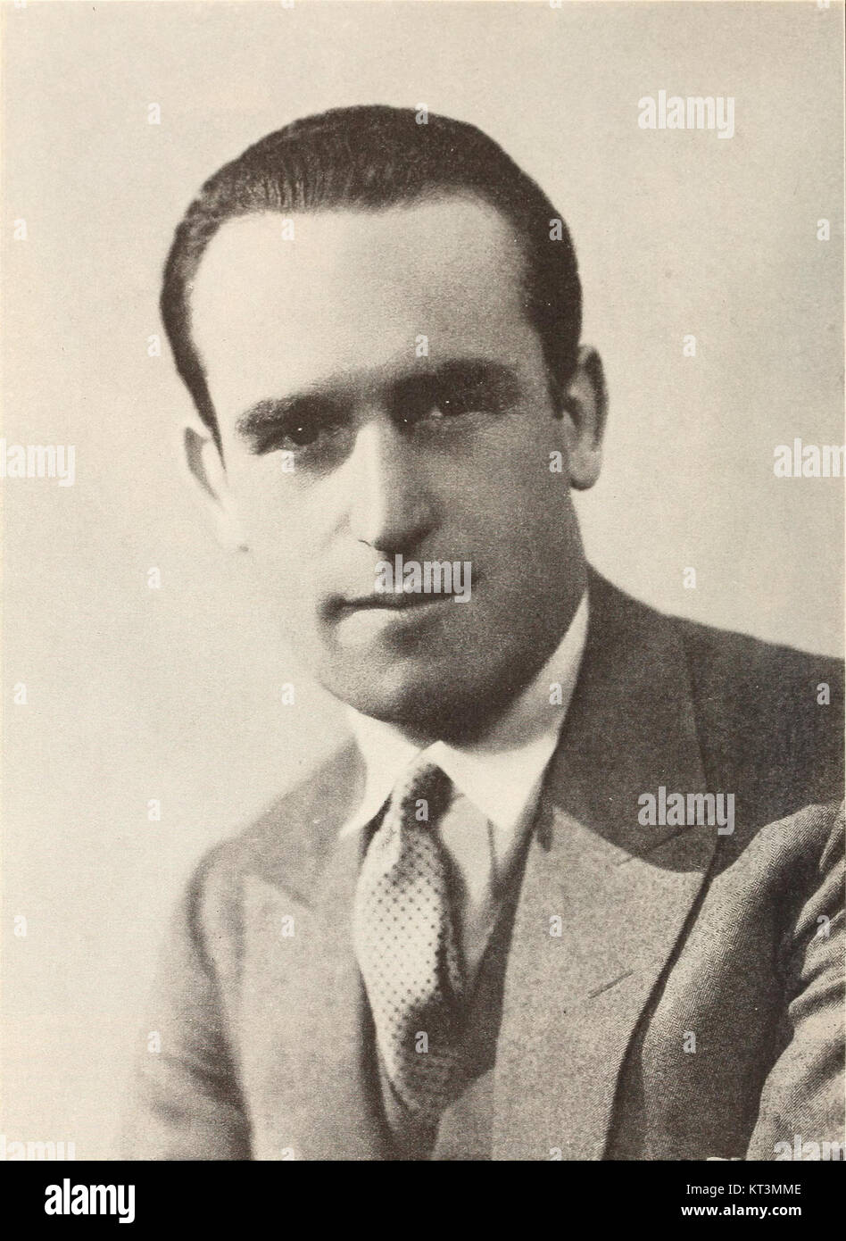 This image features Harold Lloyd, an iconic silent film actor, captured ...