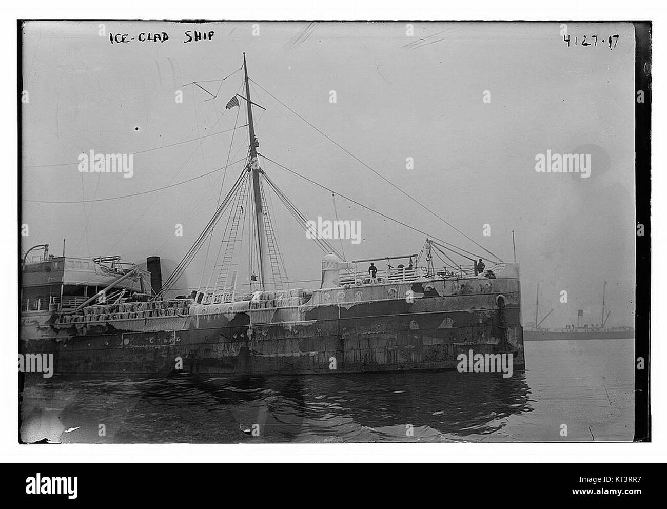 The 'Ice-clad ship' refers to a photograph of a ship heavily covered in ...
