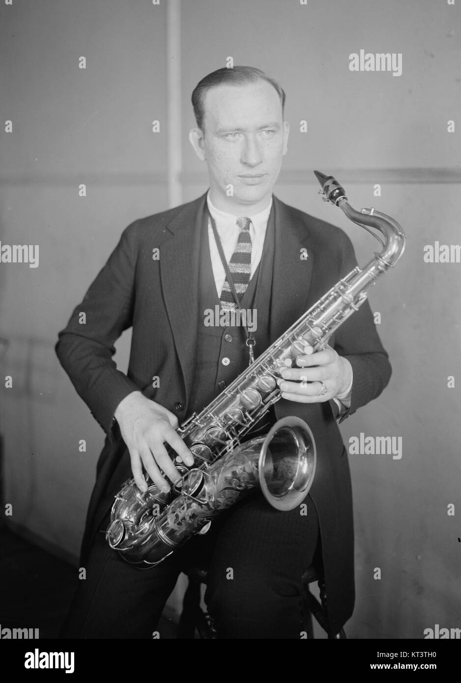 Isham Jones, an American bandleader, is photographed with his saxophone ...