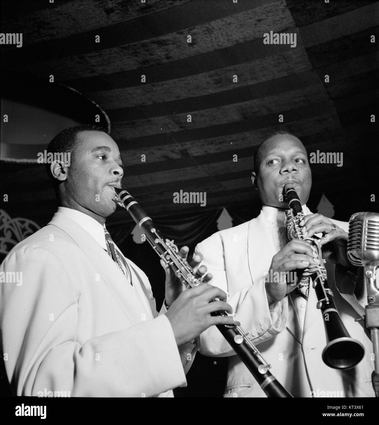 This photograph captures jazz musicians Jimmy Hamilton and Harry Carney ...