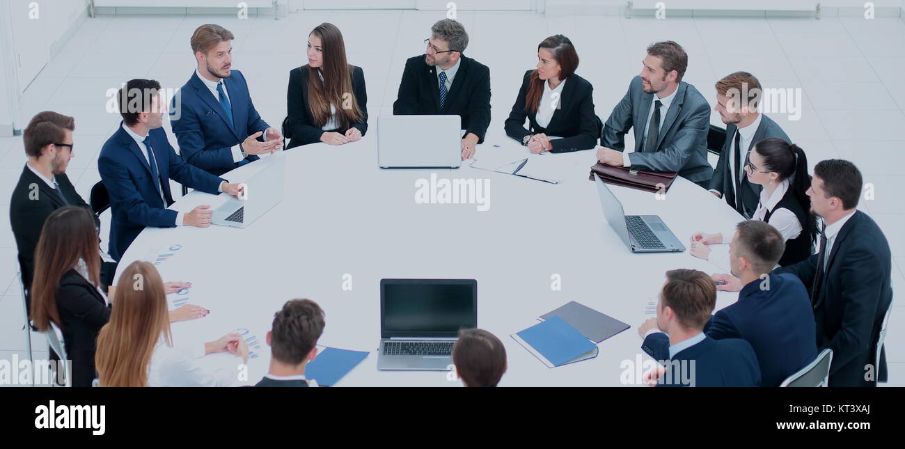 Businesspeople Sitting At Conference Round Table At The Meeting Stock ...