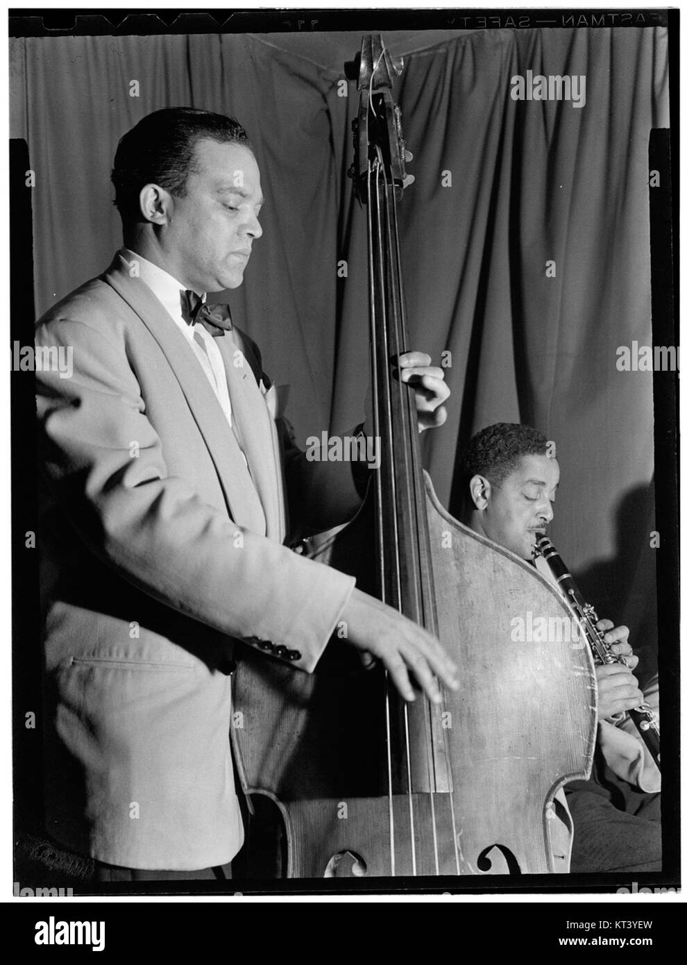 This image captures jazz musicians John Kirby and Buster Bailey ...
