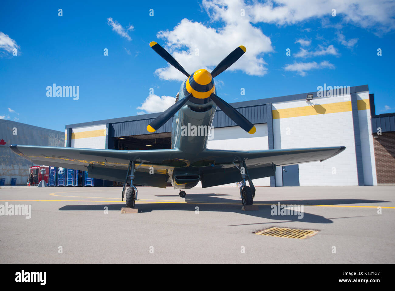 Frontal view of vintage airplane in front of the hangar, taken in ...