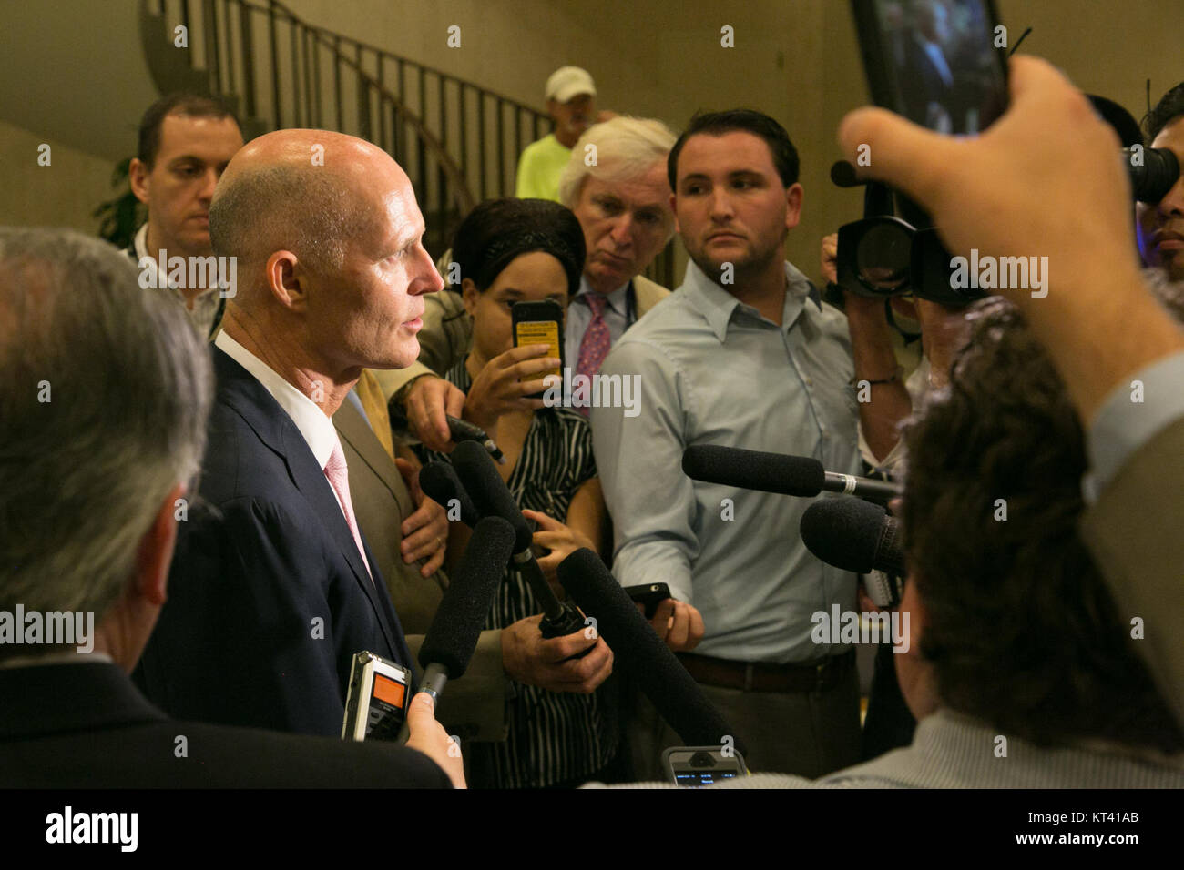 This historical image captures the moment of a bill signing, likely ...