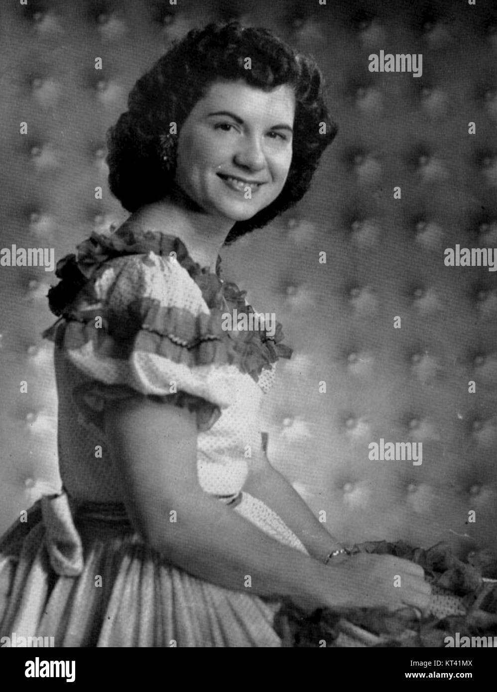 A portrait of Kitty Wells, a pioneering American country music singer ...