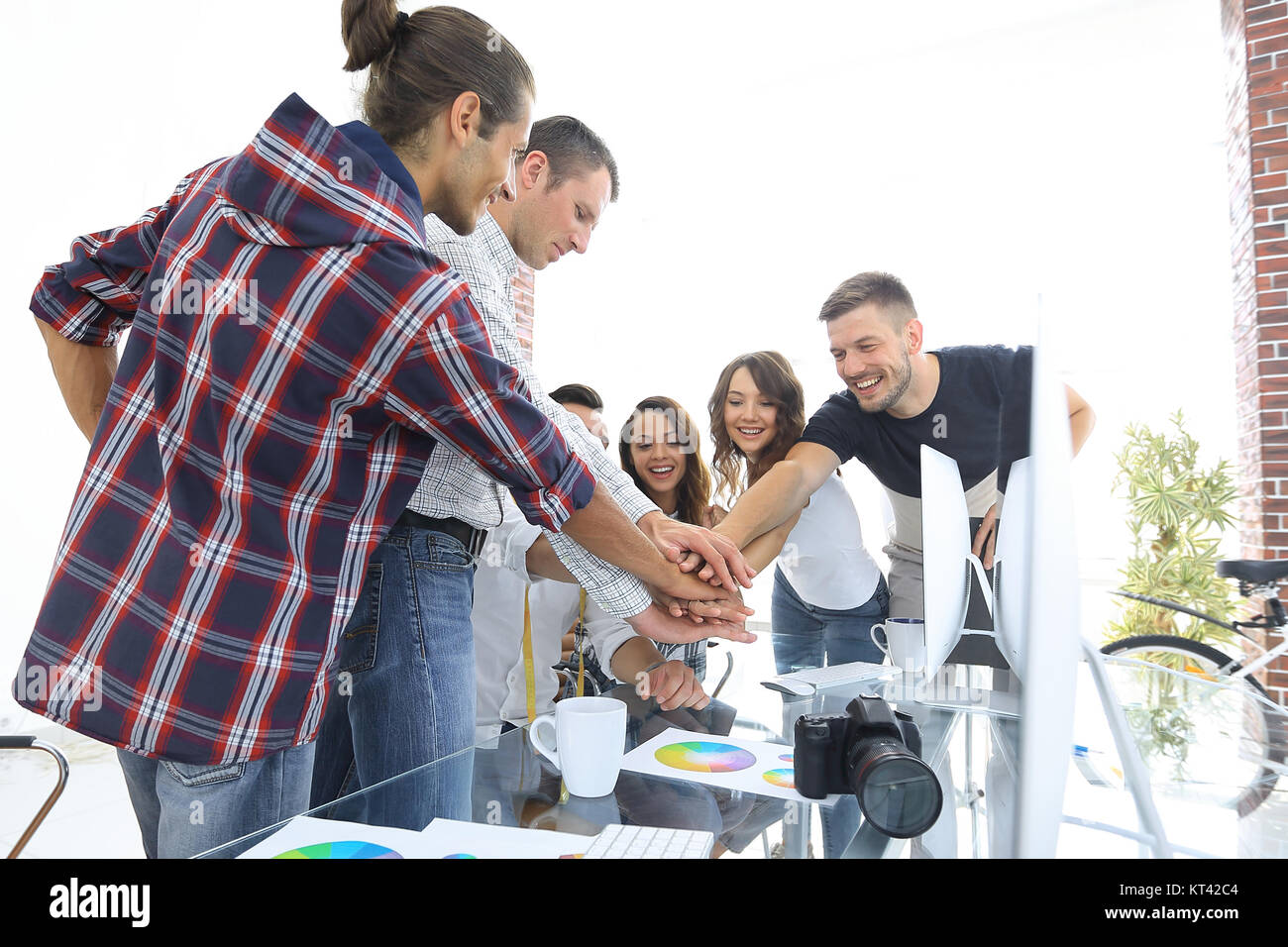 team of designers shows their success Stock Photo - Alamy