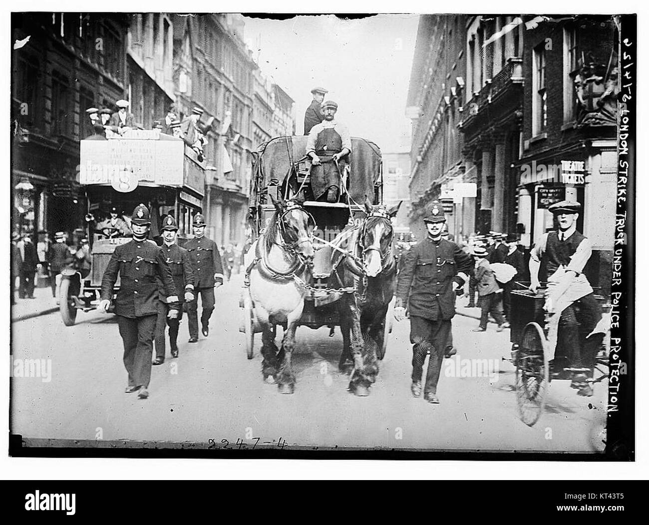 This image depicts a truck in London during a strike, with police ...