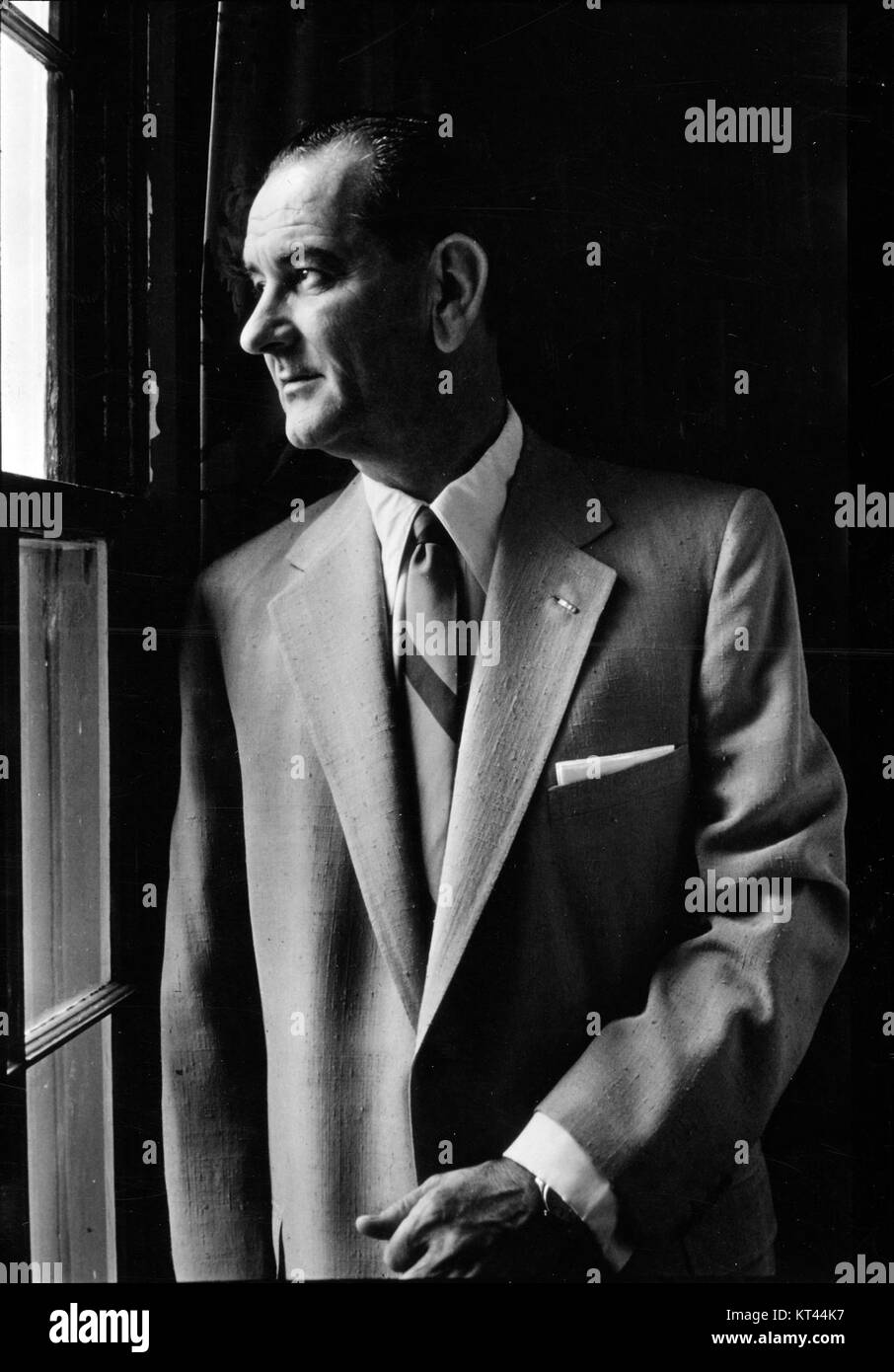 Lyndon B. Johnson looking out window 1955 ppmsca.03141 Stock Photo - Alamy