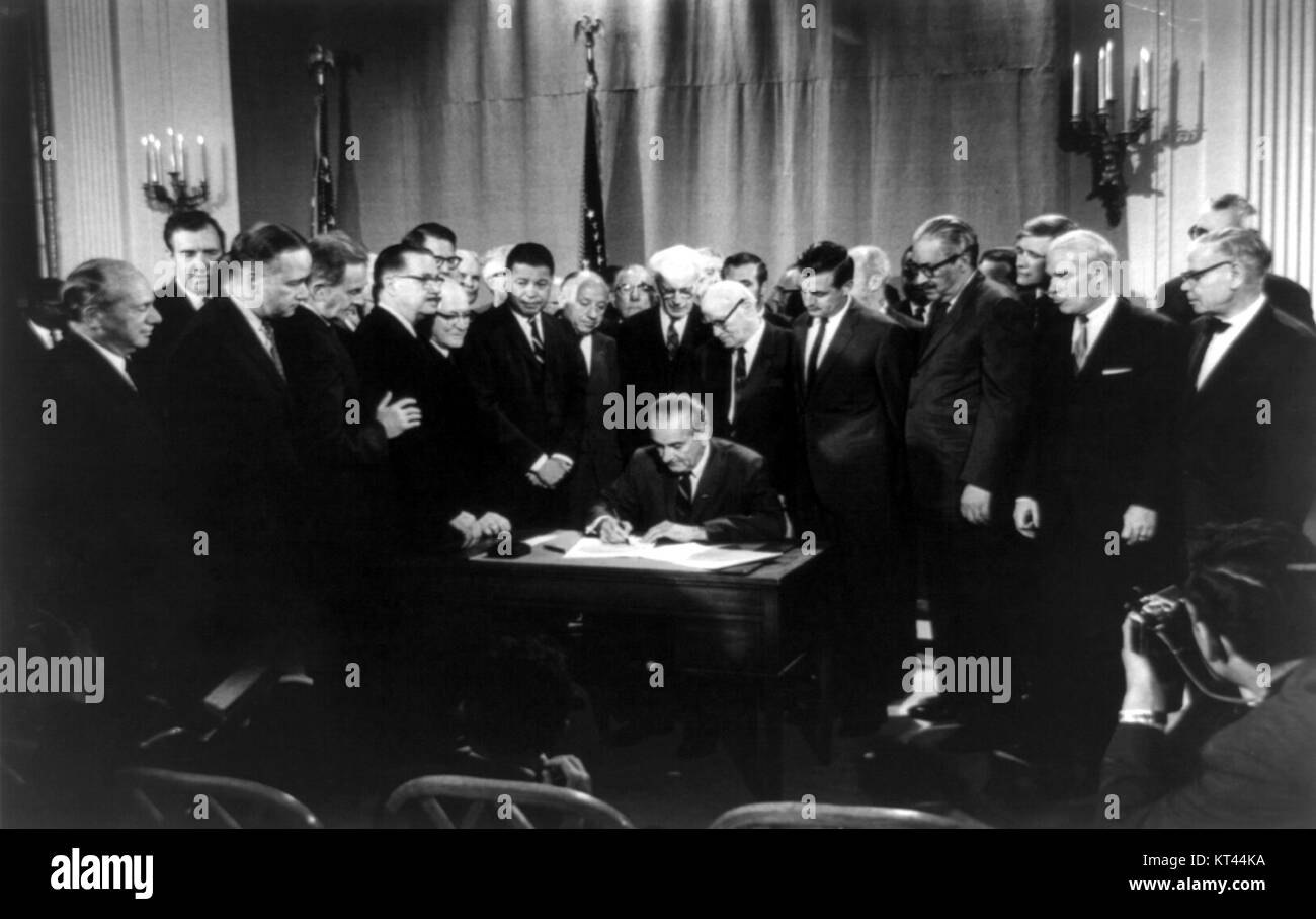 This historical photograph captures U.S. President Lyndon B. Johnson ...